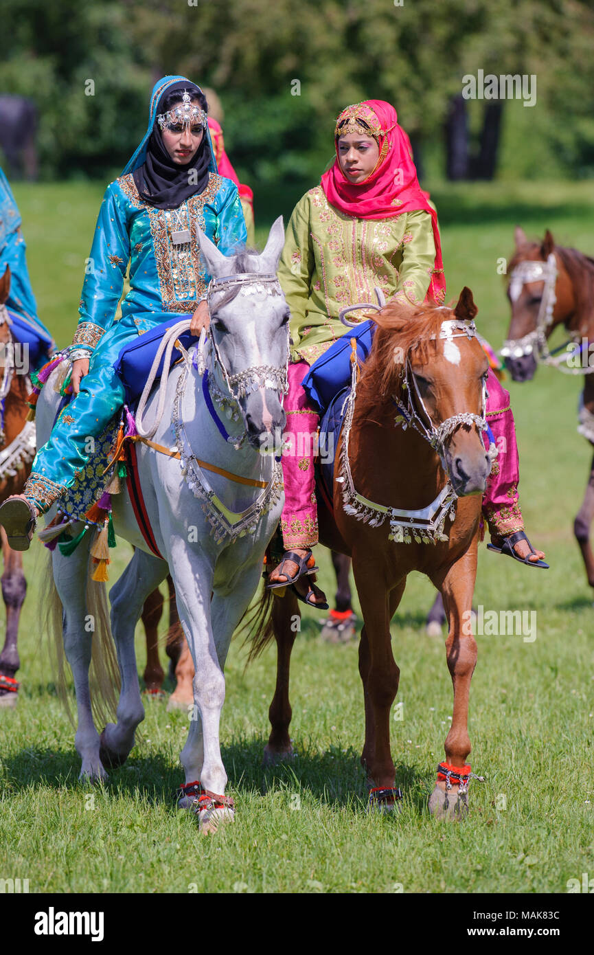 Members of the Arab show group "Royal Cavalry of Oman" ride in ...