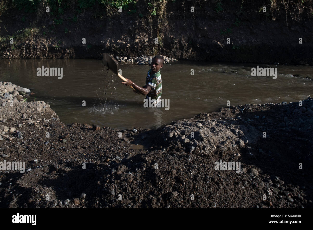 Digger extracting sand in a river ( Ehiopia Stock Photo - Alamy