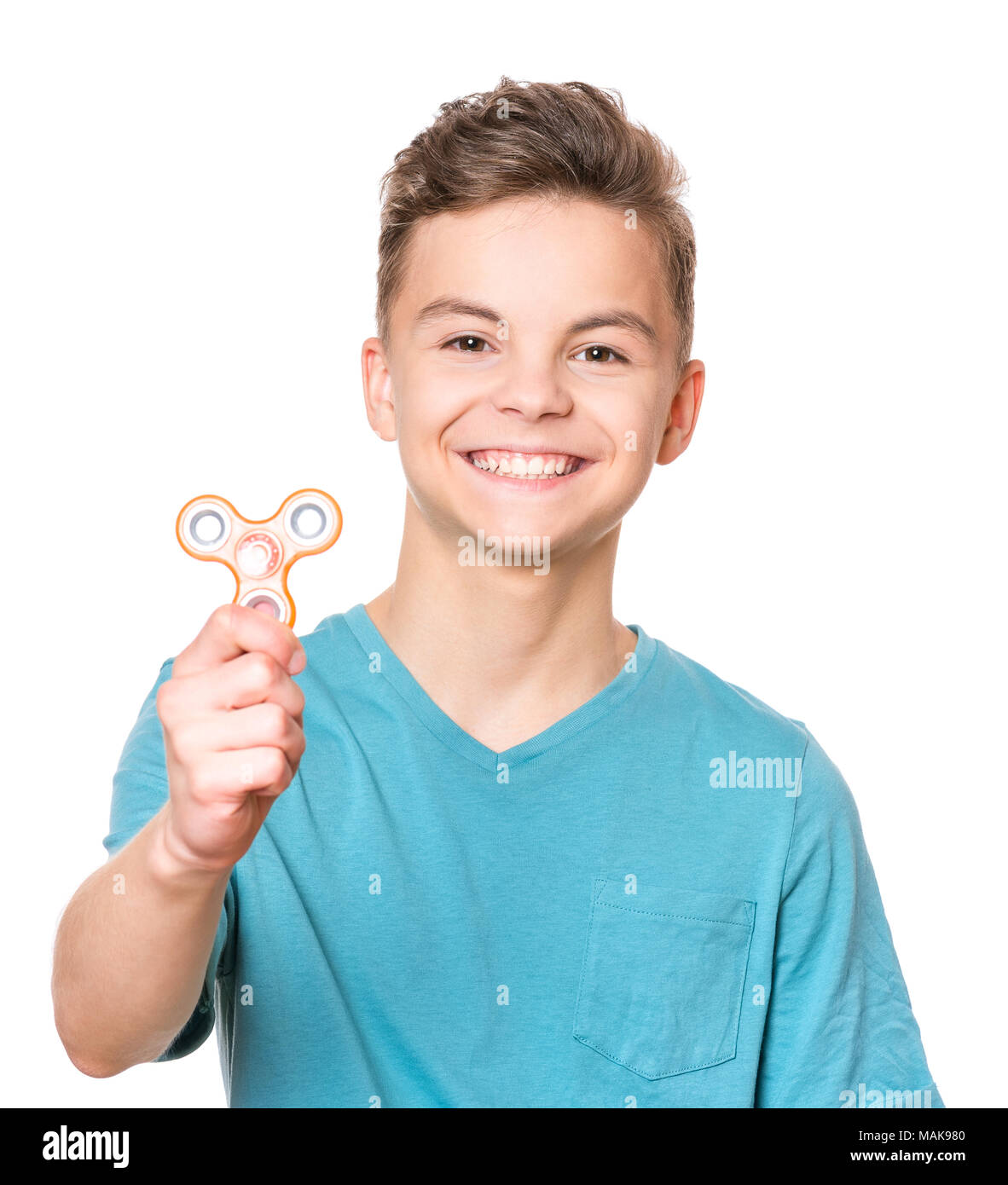 Teen boy with spinner toy Stock Photo - Alamy