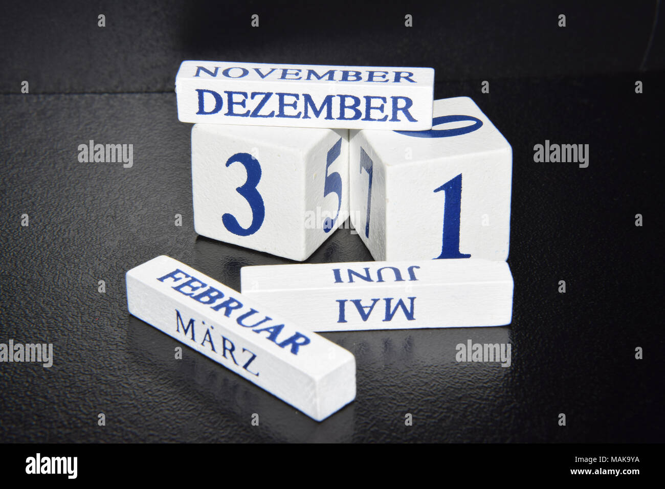 White Wooden Blocks Depicting Day Numbers and Months - Calendar Dice ...