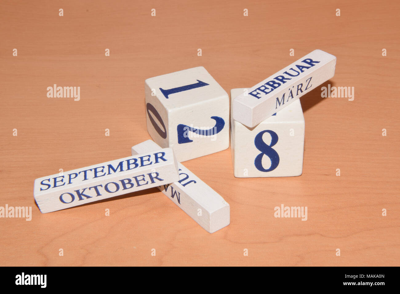Calendar Dice on Wooden Background - Date Cubes Stock Photo - Alamy