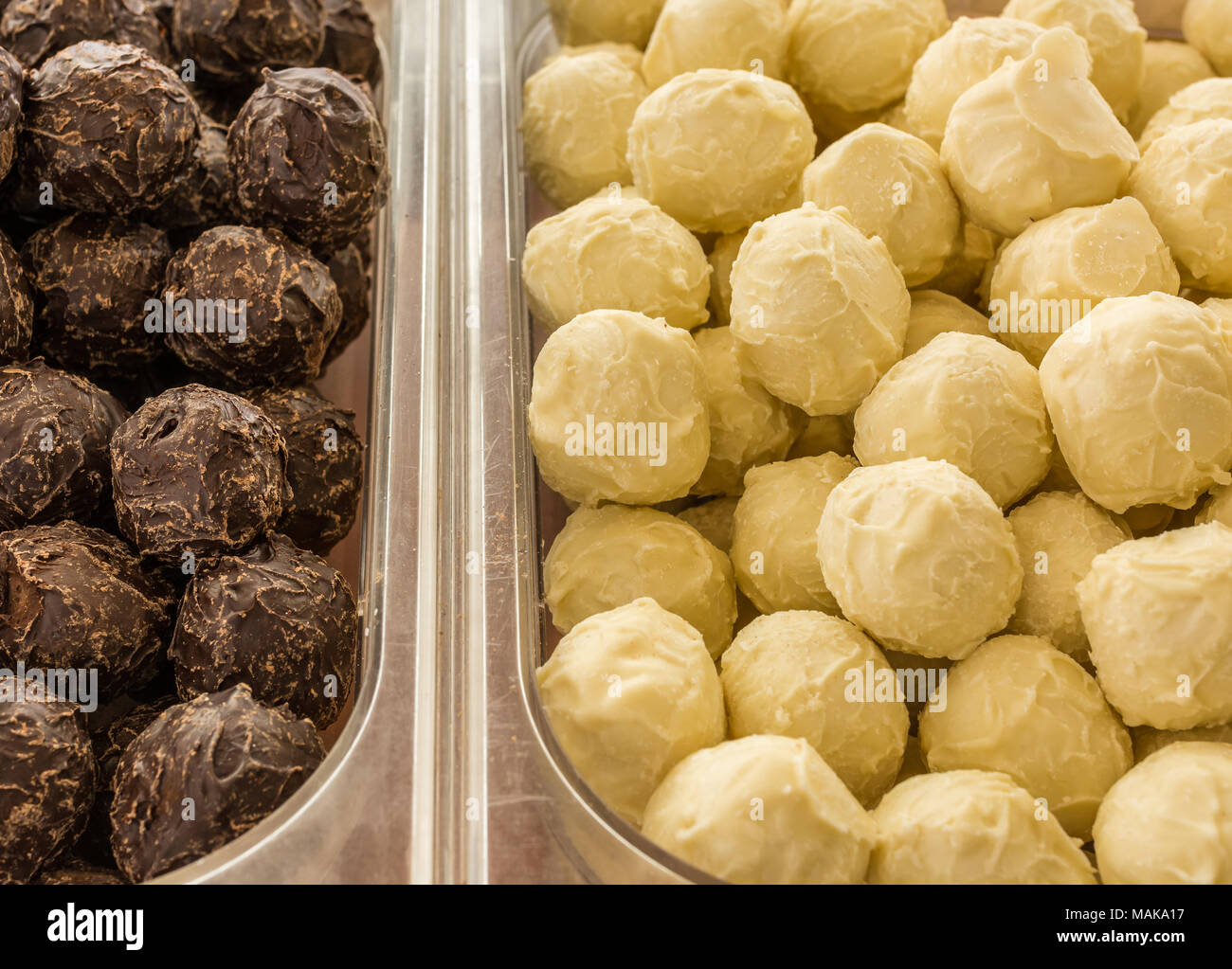 Delicious truffles chocolates. White truffles chocolate and dark ...