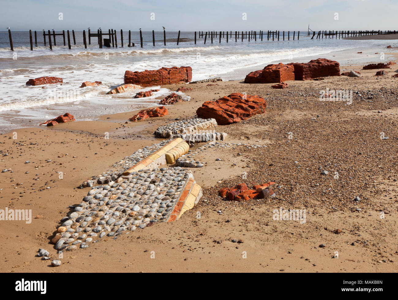 The remains of the Low Light Lighthouse on the beach at Happisburgh in ...