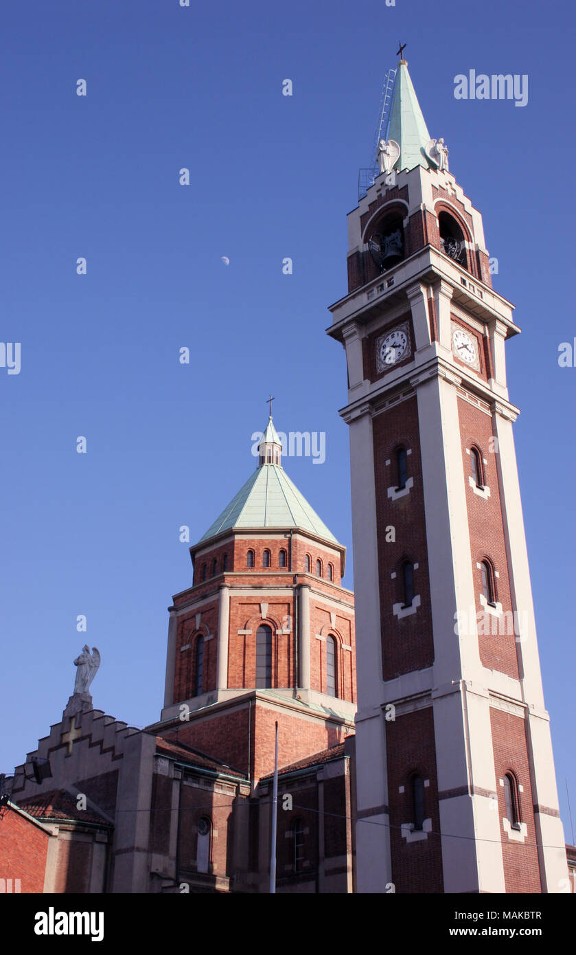 Milan church (basilica) with clock tower, belfry and dome. Known as ...