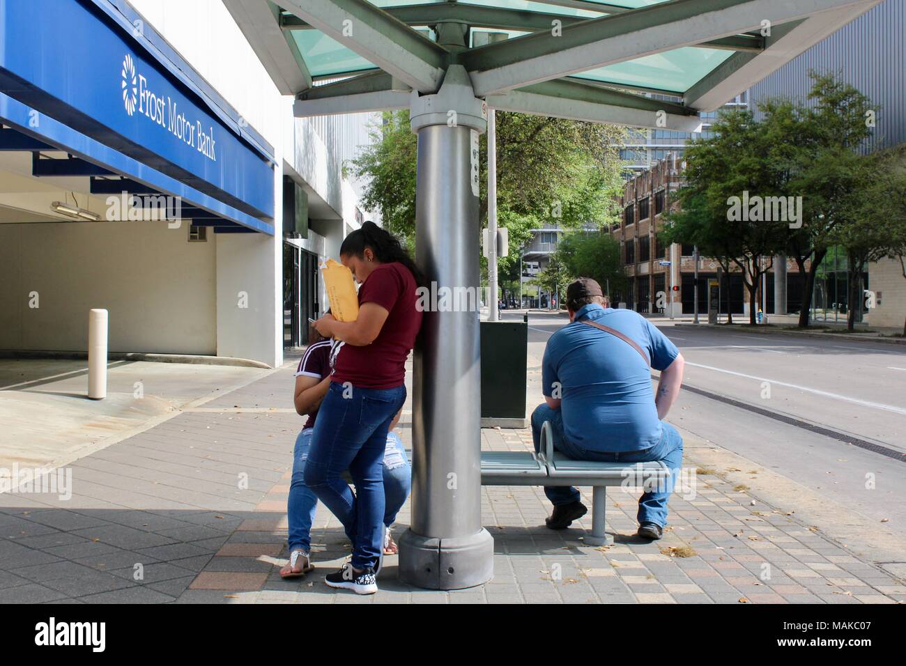 larger passengers waiting for a bus in downtown houston texas USA Stock ...