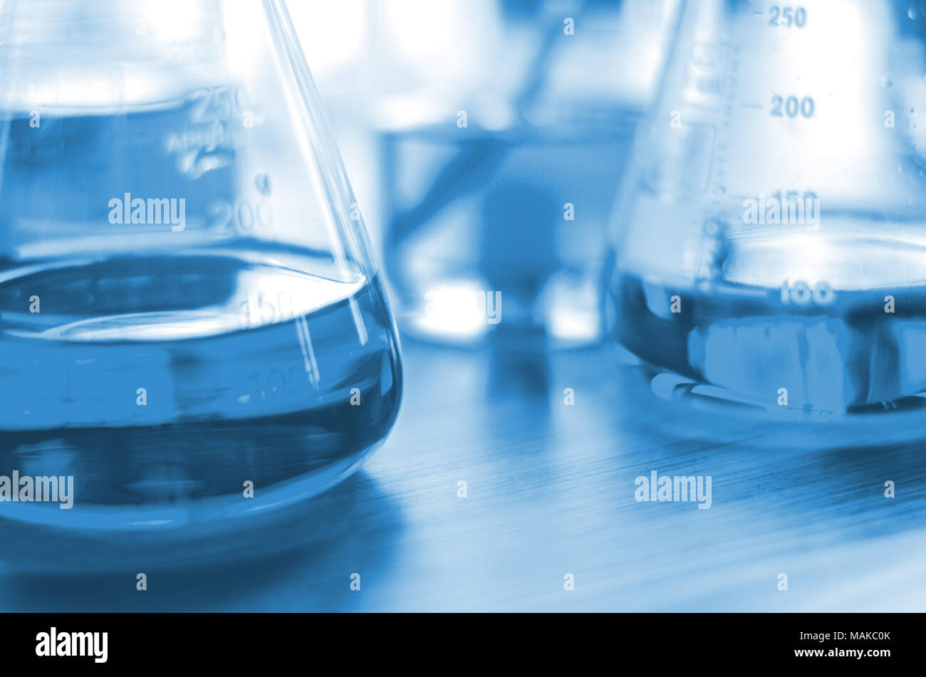 three erlenmeyer flask , Glassware on science laboratory research and ...