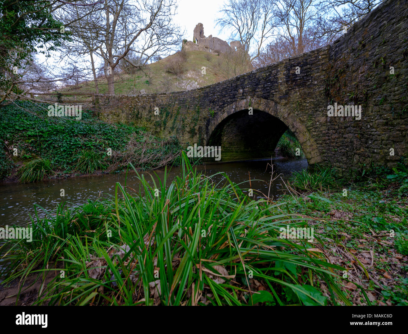 View of the stream and bridge below Corfe Castle, Purbeck, Dorset, UK ...