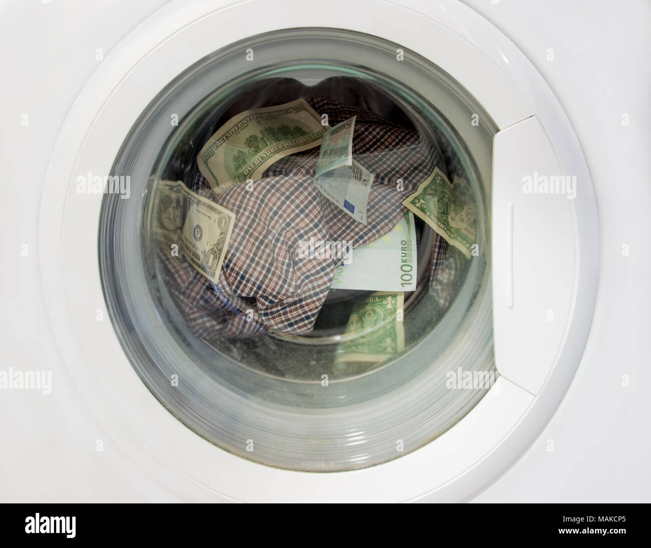 Money laundering in washing machine hi-res stock photography and images ...