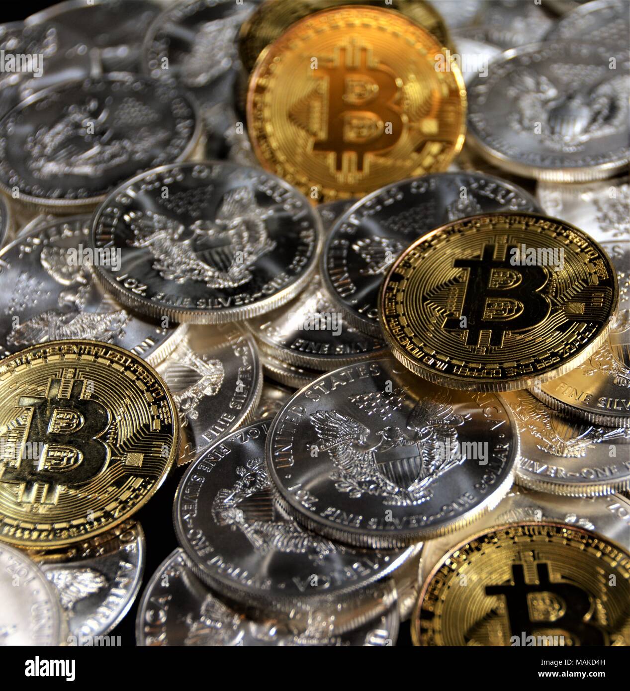 Bit coins with silver dollars and diamonds Stock Photo - Alamy