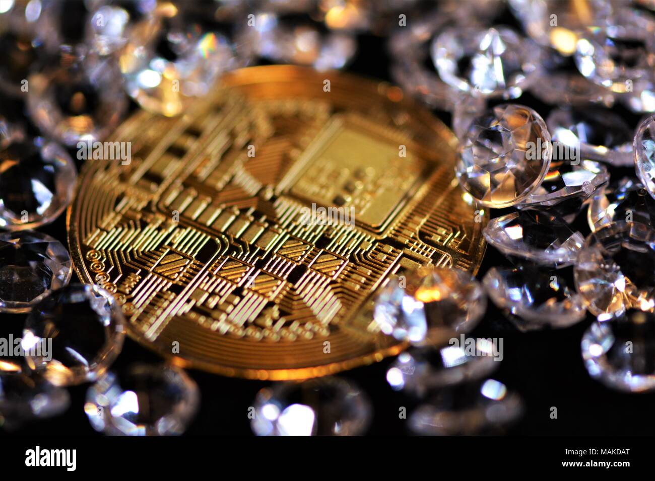 Bit coins with silver dollars and diamonds Stock Photo - Alamy
