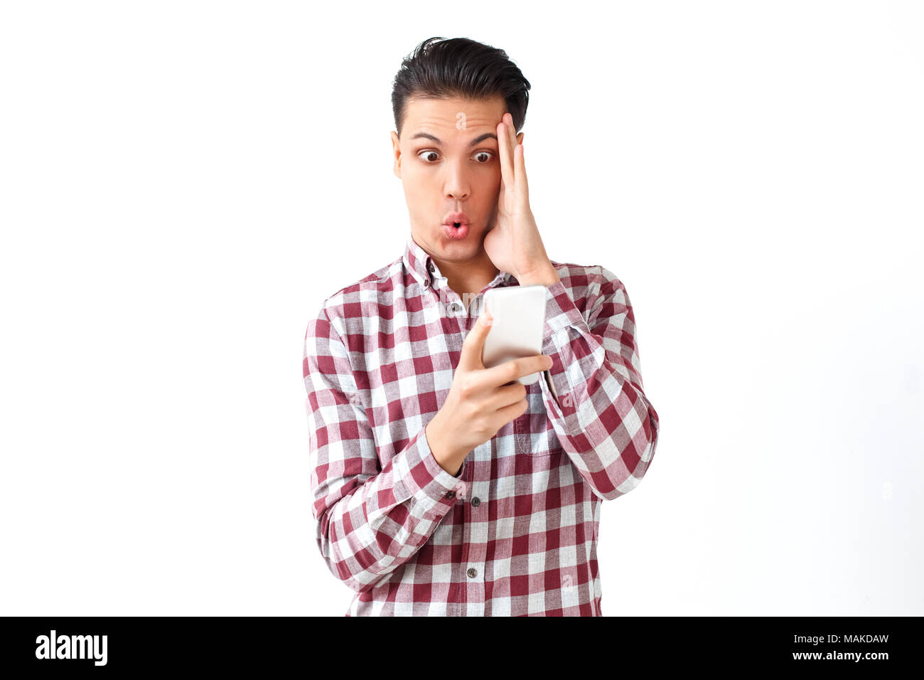 Amazement man looking at screen phone and watching unbelievable video ...