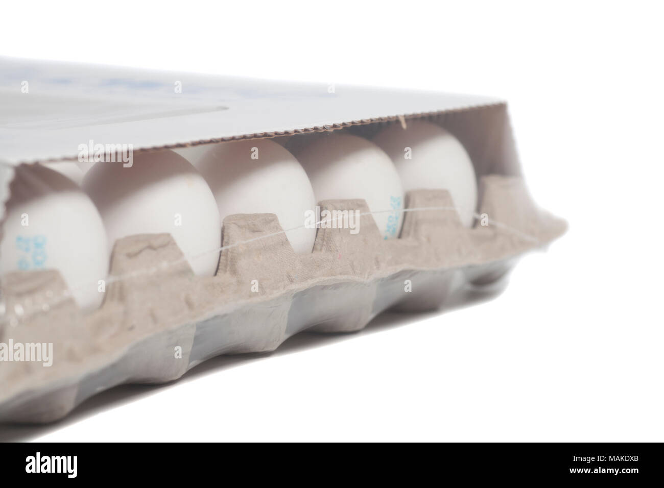 Cardboard egg box with chicken white eggs isolated on white background ...