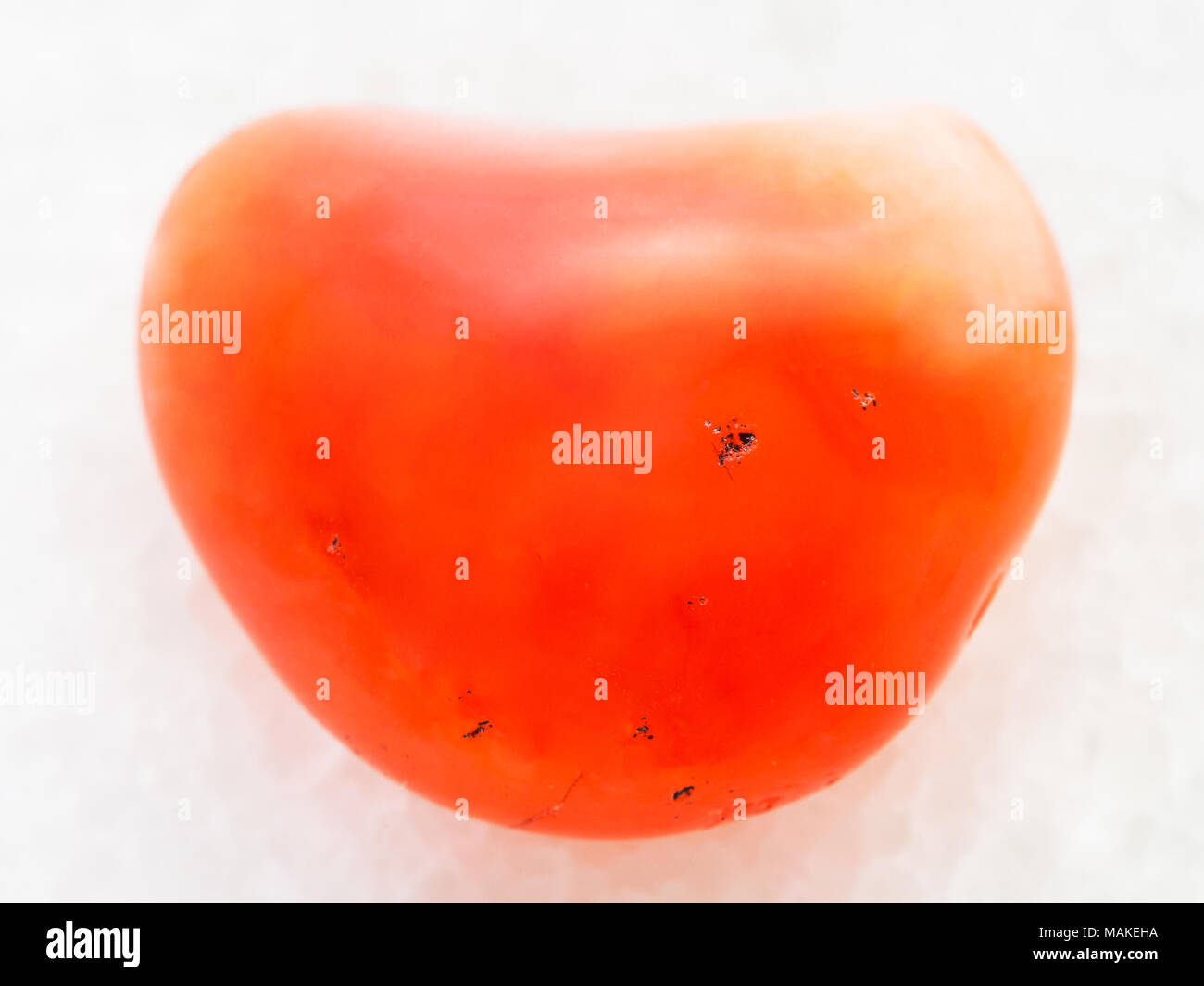 macro shooting of natural mineral rock specimen - tumbled carnelian gem ...
