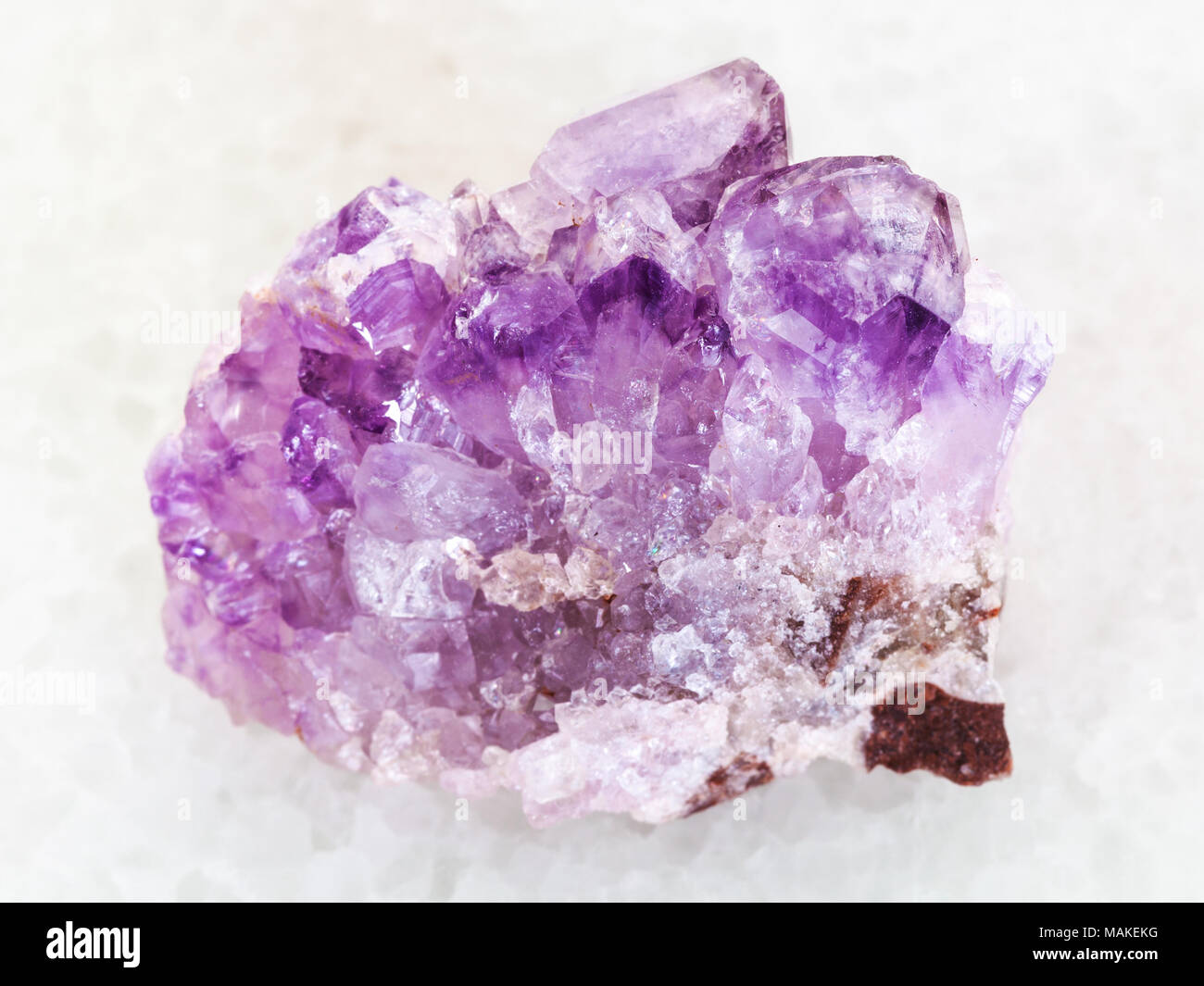 macro shooting of natural mineral rock specimen - raw Amethyst crystal ...