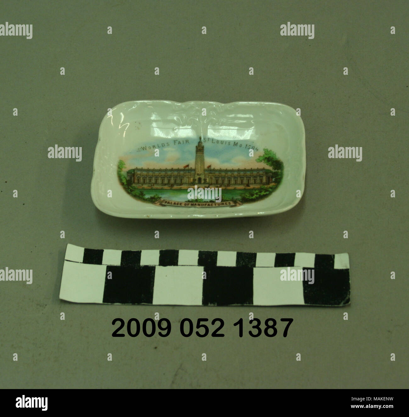 White rectangular ceramic pin tray has color transfer image of the ...