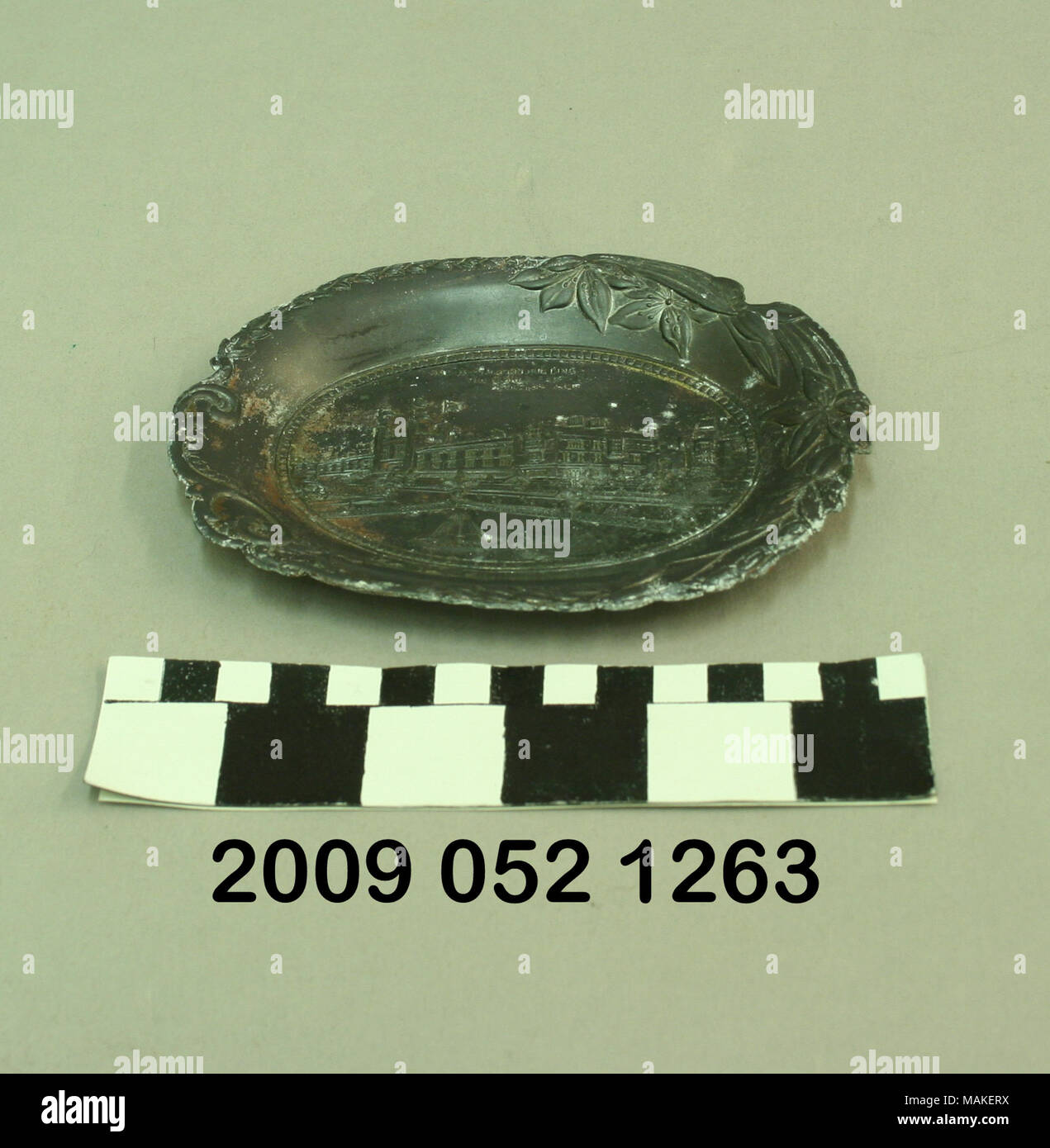 Oval metal pin tray with a raised image of the Administration Building ...