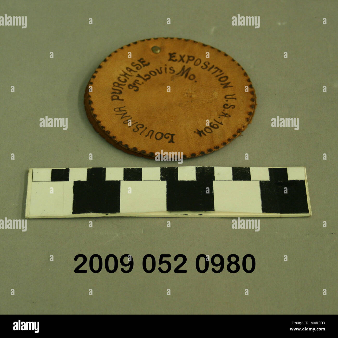 Round leather notepad with a single leather page inside bound with a ...