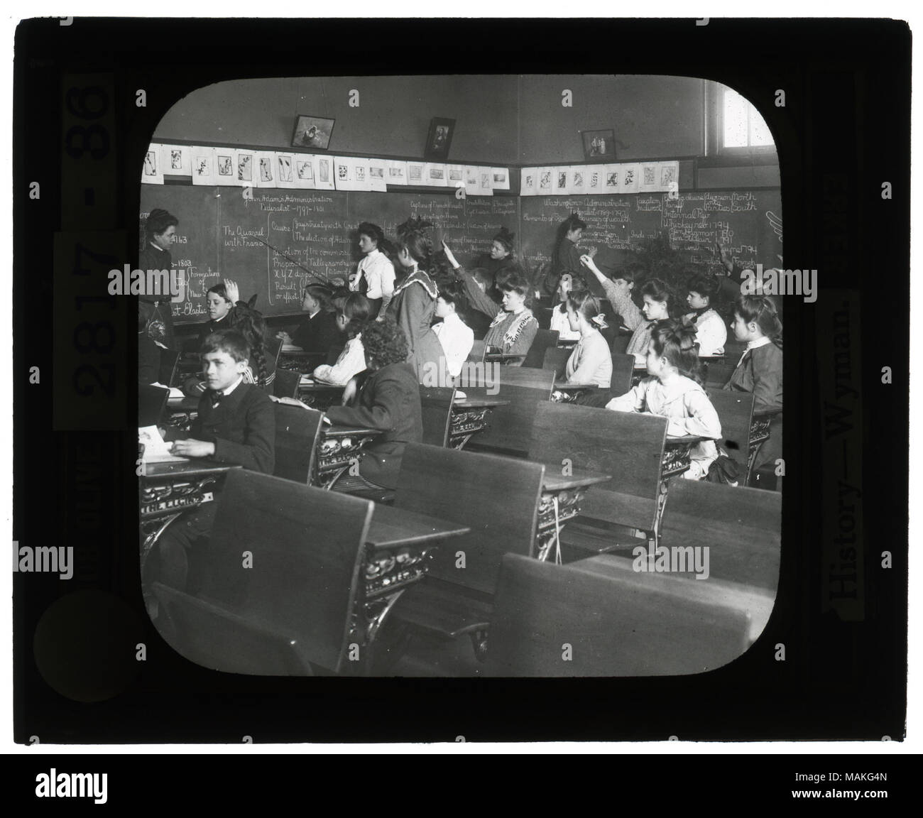 Horizontal, black and white photo of classroom setting with the ...