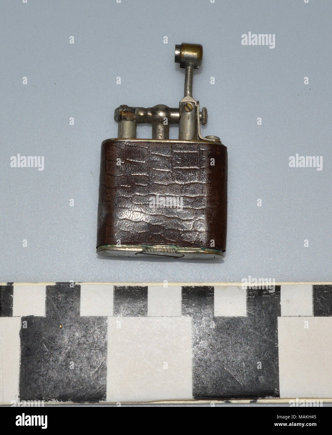 Rectangular lift arm table lighter wrapped with leather fueled by ...