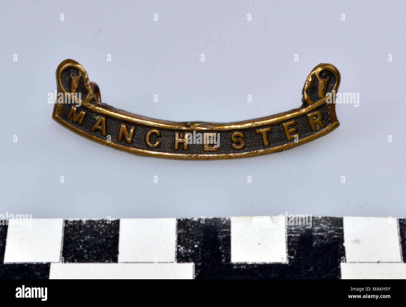 World War I Manchester Regiment brass scroll or banner shaped shoulder ...
