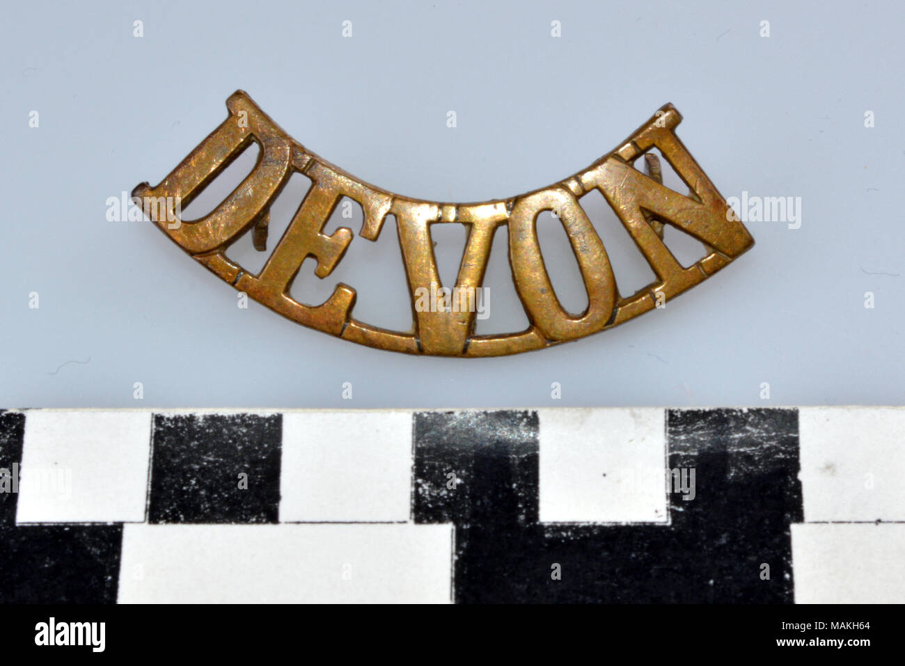 World War I Devonshire Regiment brass shoulder title formed by the cut ...