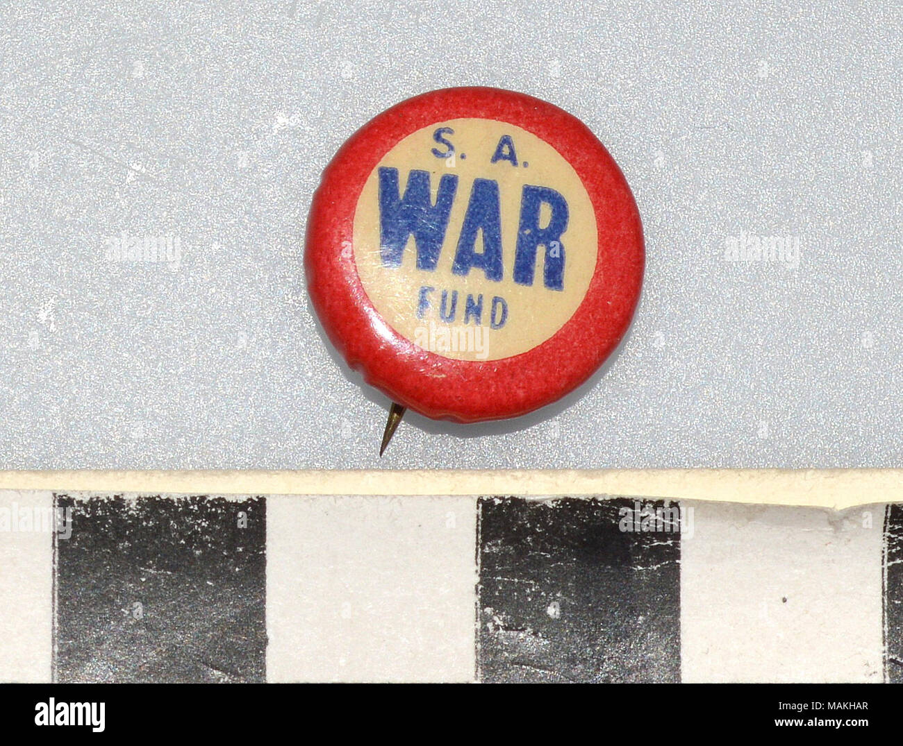 Small round red and white pin promoting the S.A. (Salvation Army) War ...