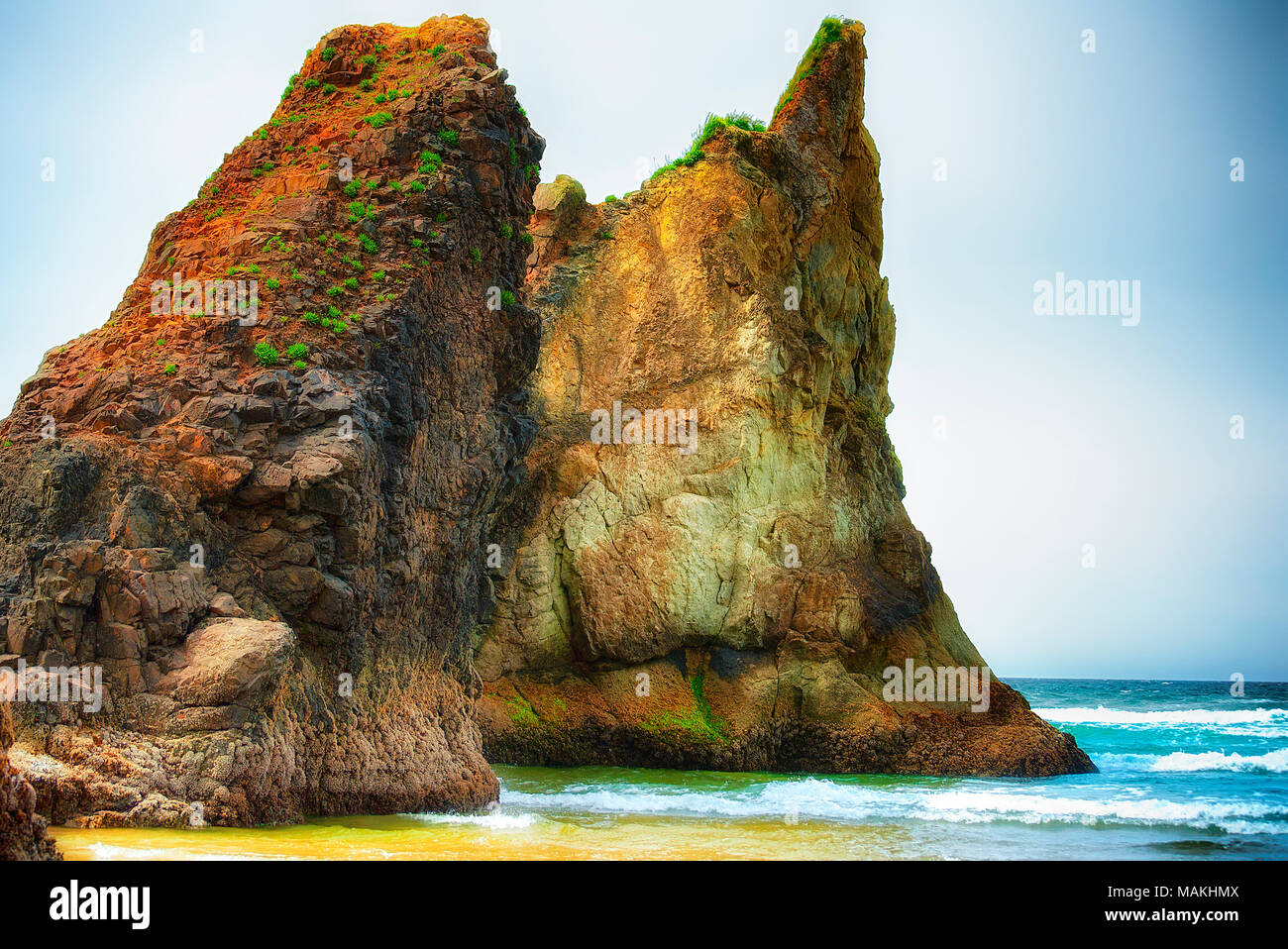 Small waves roll around huge intertidal rocks and onto to Arcadia beach ...