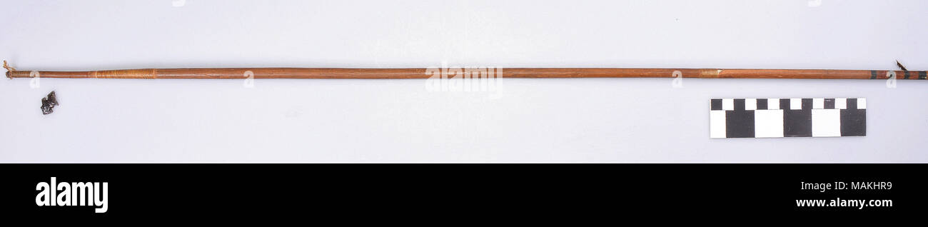 Long, Native American arrow with obsidian point. The shaft of the arrow ...