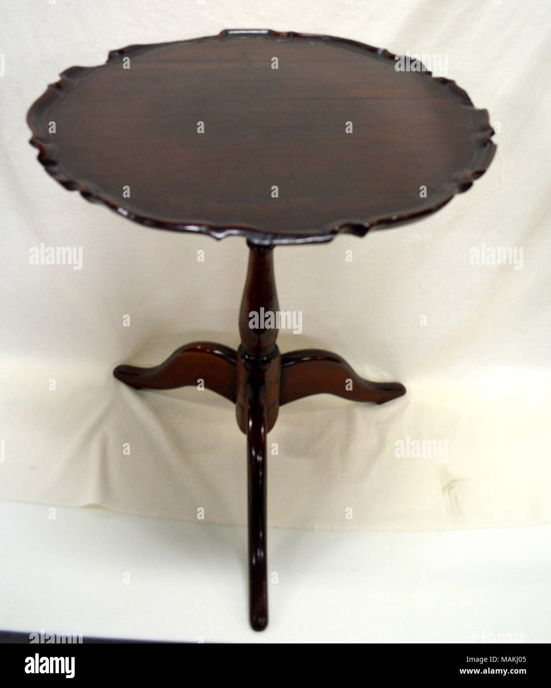 Wood pedestal table with three legs and a pie-crust top, modified ...