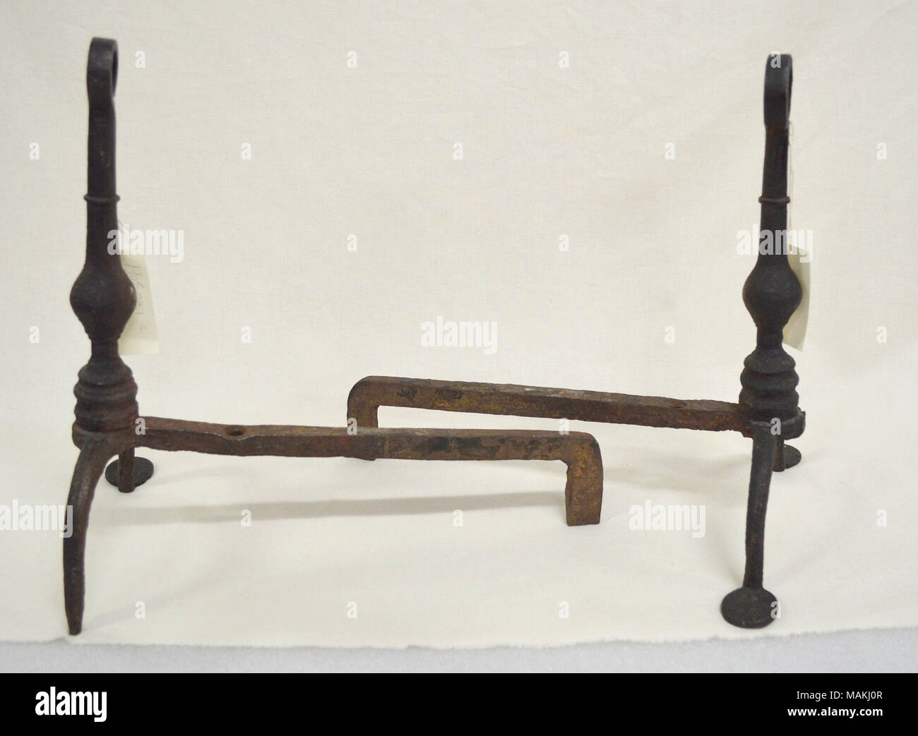 Pair of hand wrought metal andirons. Title: Hand-wrought Metal Andiron ...