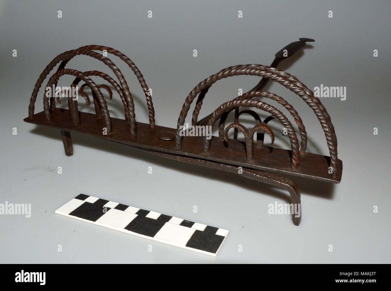 Wrought iron toaster. Swivel top allows bread to be toasted on both ...