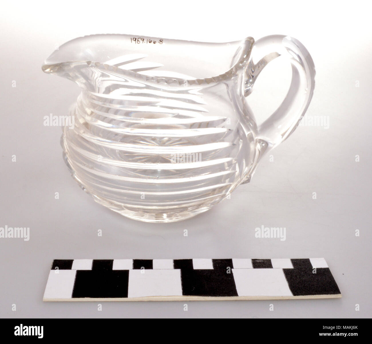 Clear glass cream pitcher. Similar to the style from the United Kingdom ...