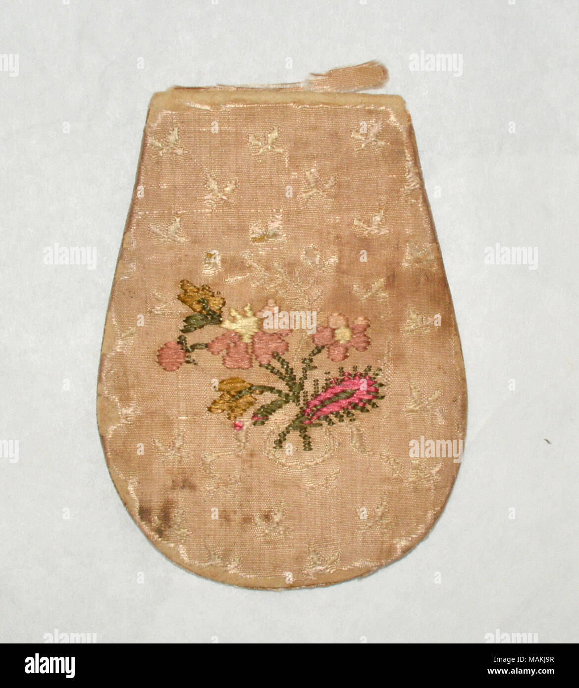 Small silk needle case embroidered with flowers on the outside and ...