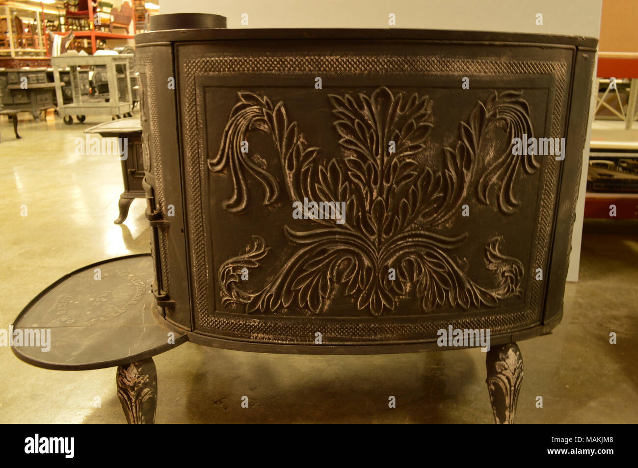 Oval cast iron heating stove produced by the Bridge & Brother Company ...