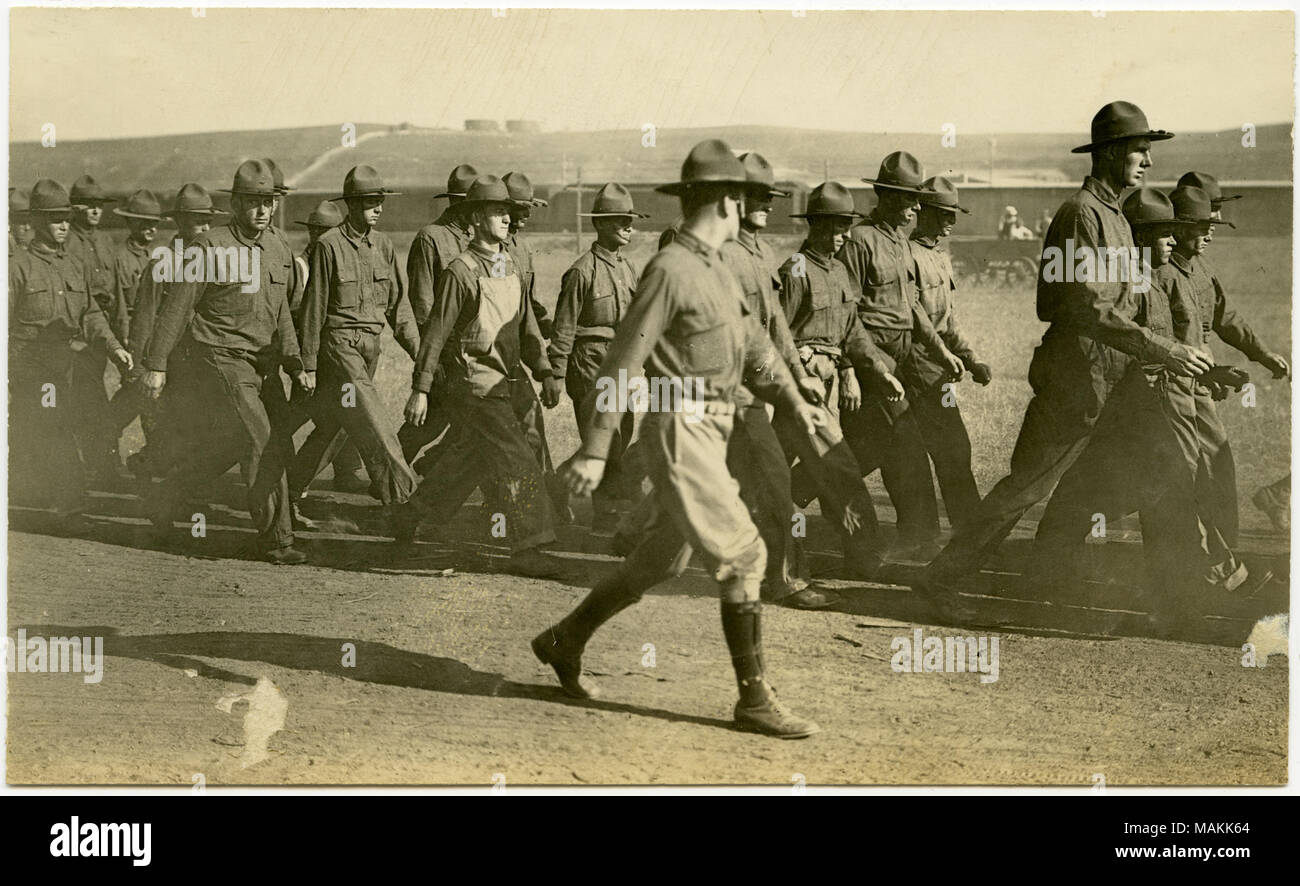 Horizontal, sepia photograph showing men in World War I era uniforms ...