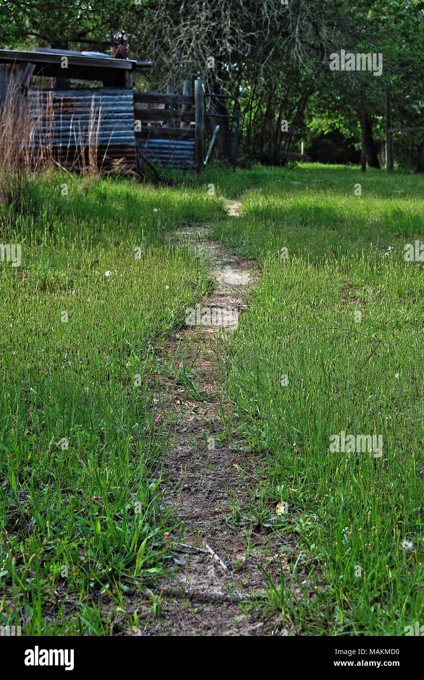 Walking path to the animal pens in central rural Texas hill country ...