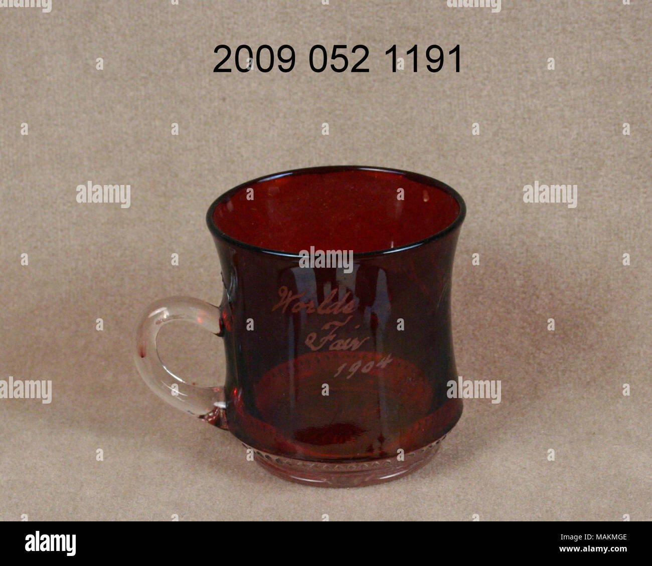 Ruby stained mug has small clear pressed beaded bottom and is ...