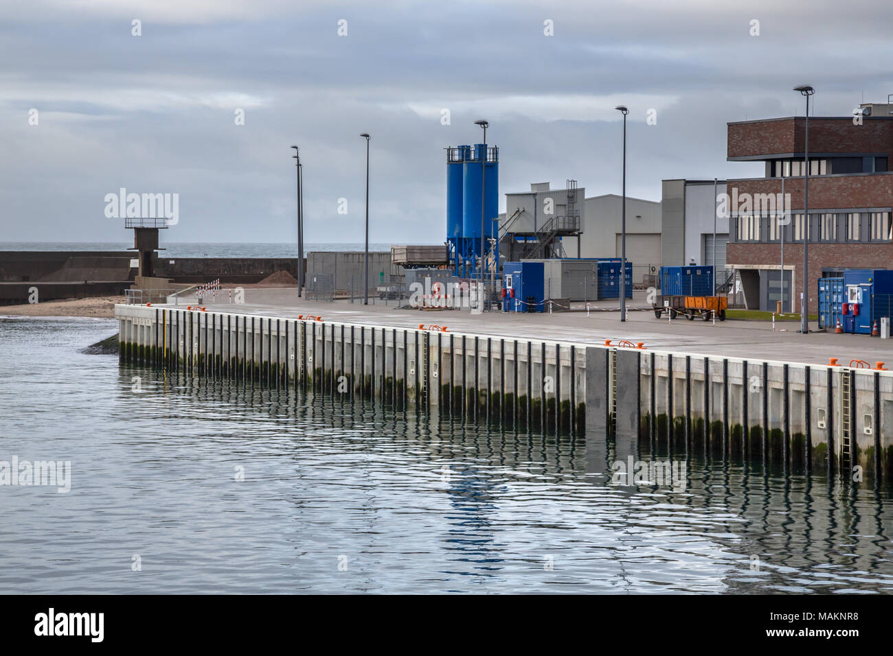 Detail of small industrial harbor with new modern quay Stock Photo - Alamy