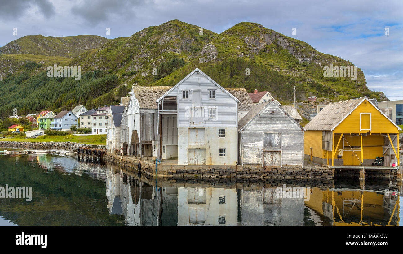 Colorful houses and old wooden warehouses in Runde Island harbour ...