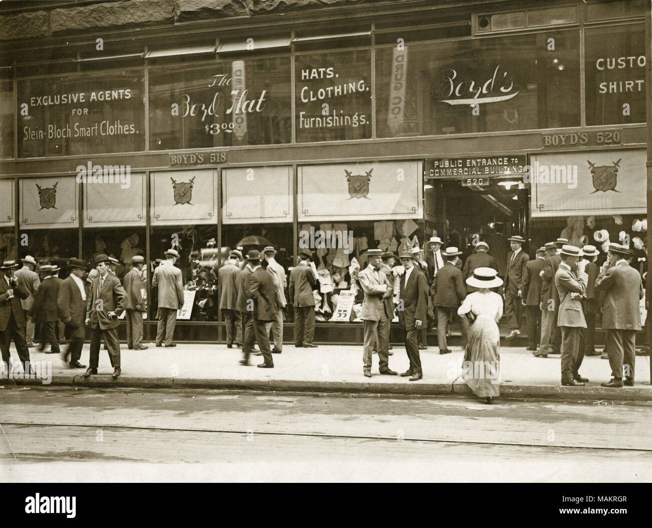 Title: Pedestrians on the sidewalk in front of Boyd's Department Store ...