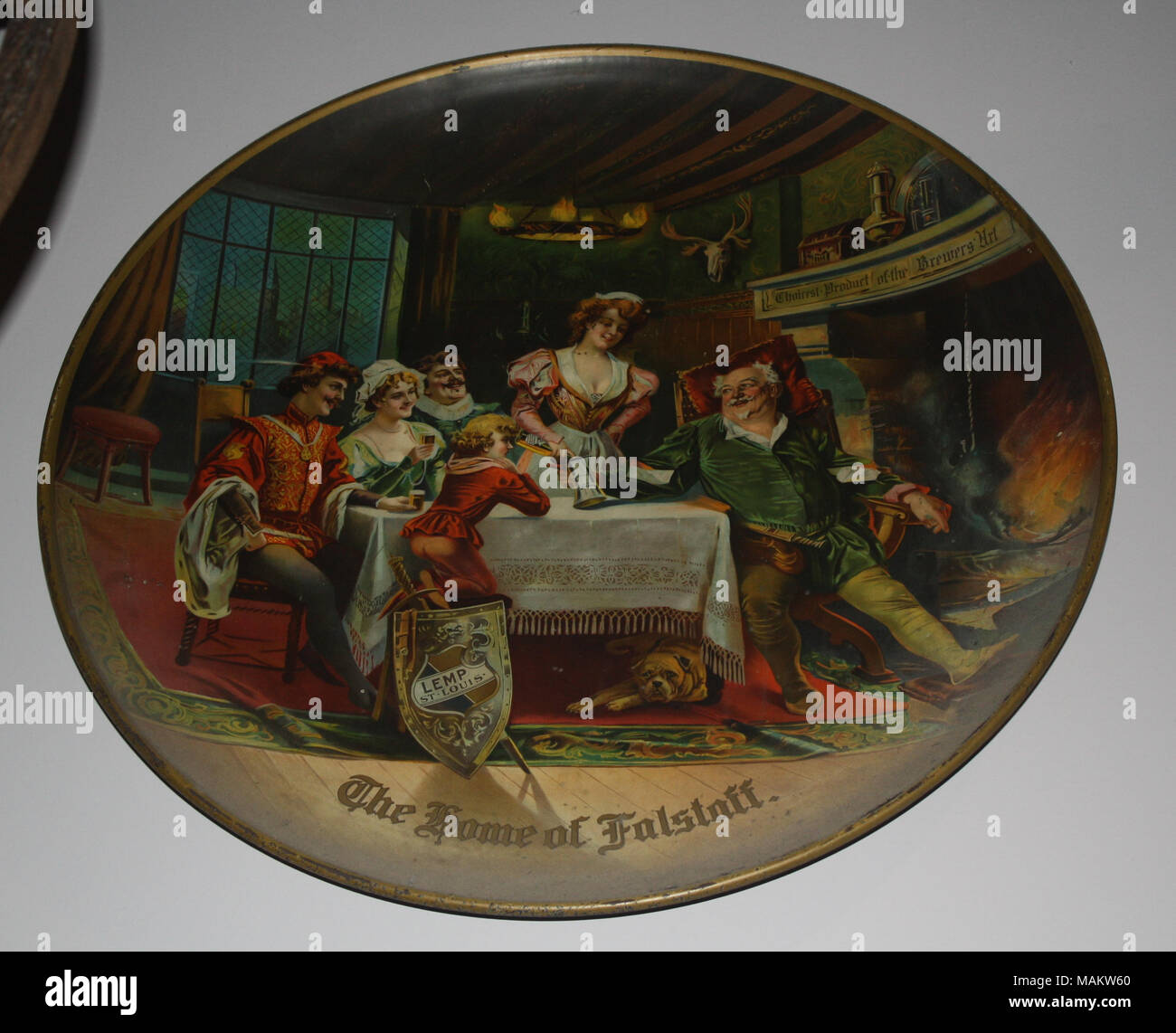 Round metal tray with painted picture of group sitting around table ...