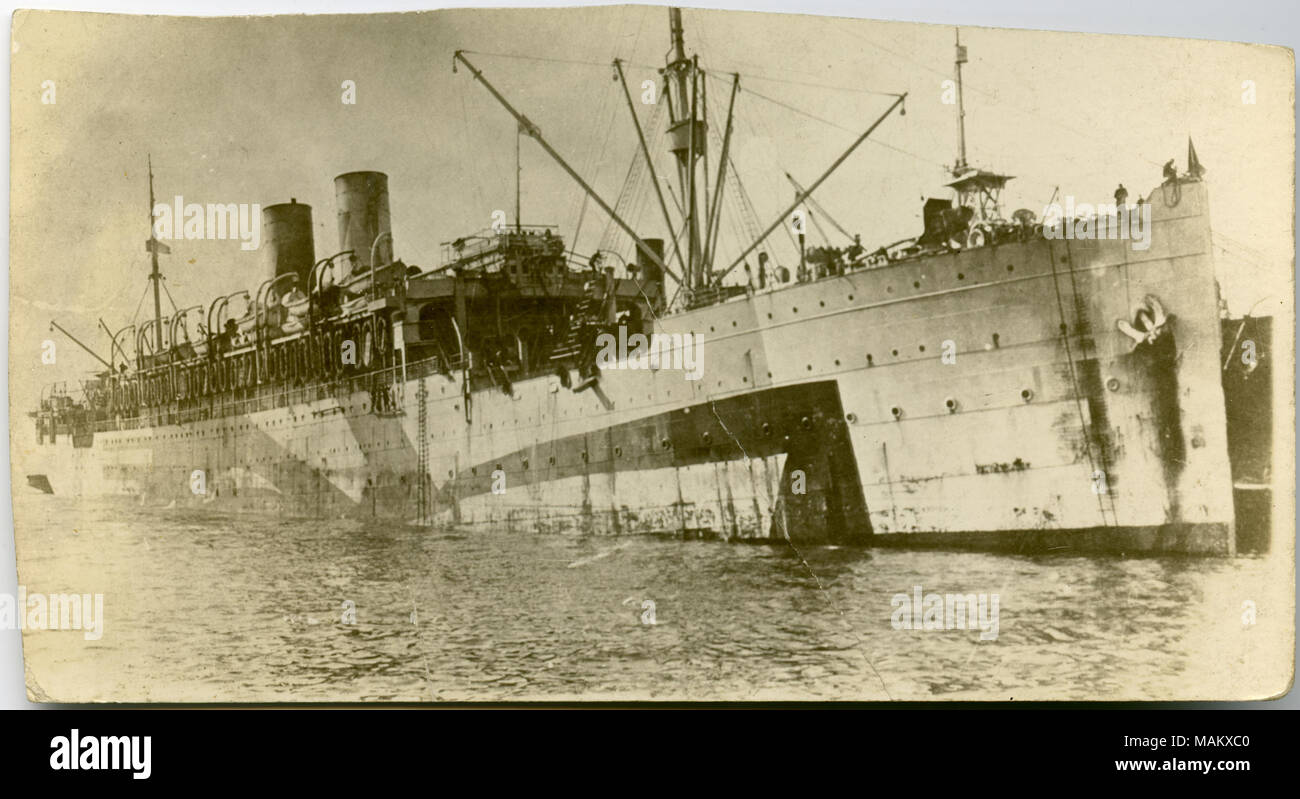 Horizontal, sepia photograph showing a large ship sailing on a body of ...