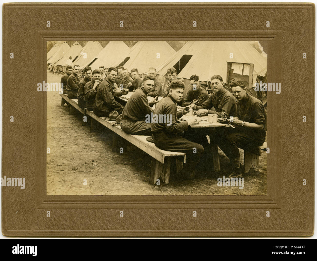 Horizontal, sepia photograph showing a group of uniformed soldiers ...