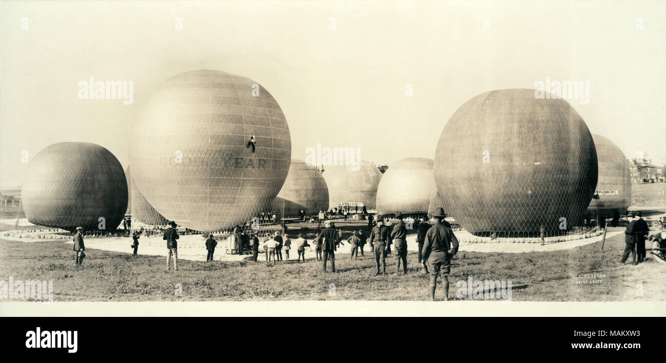 Horizontal, black and white panoramic photograph showing several hot ...