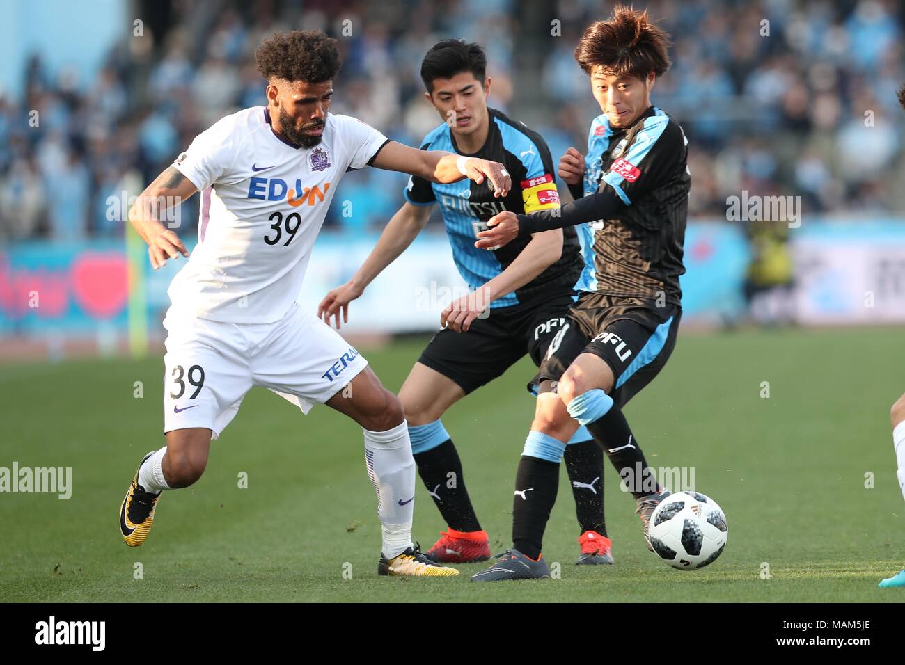 Kanagawa, Japan. 31st Mar, 2018. (L-R) Patric (Sanfrecce), Shogo ...