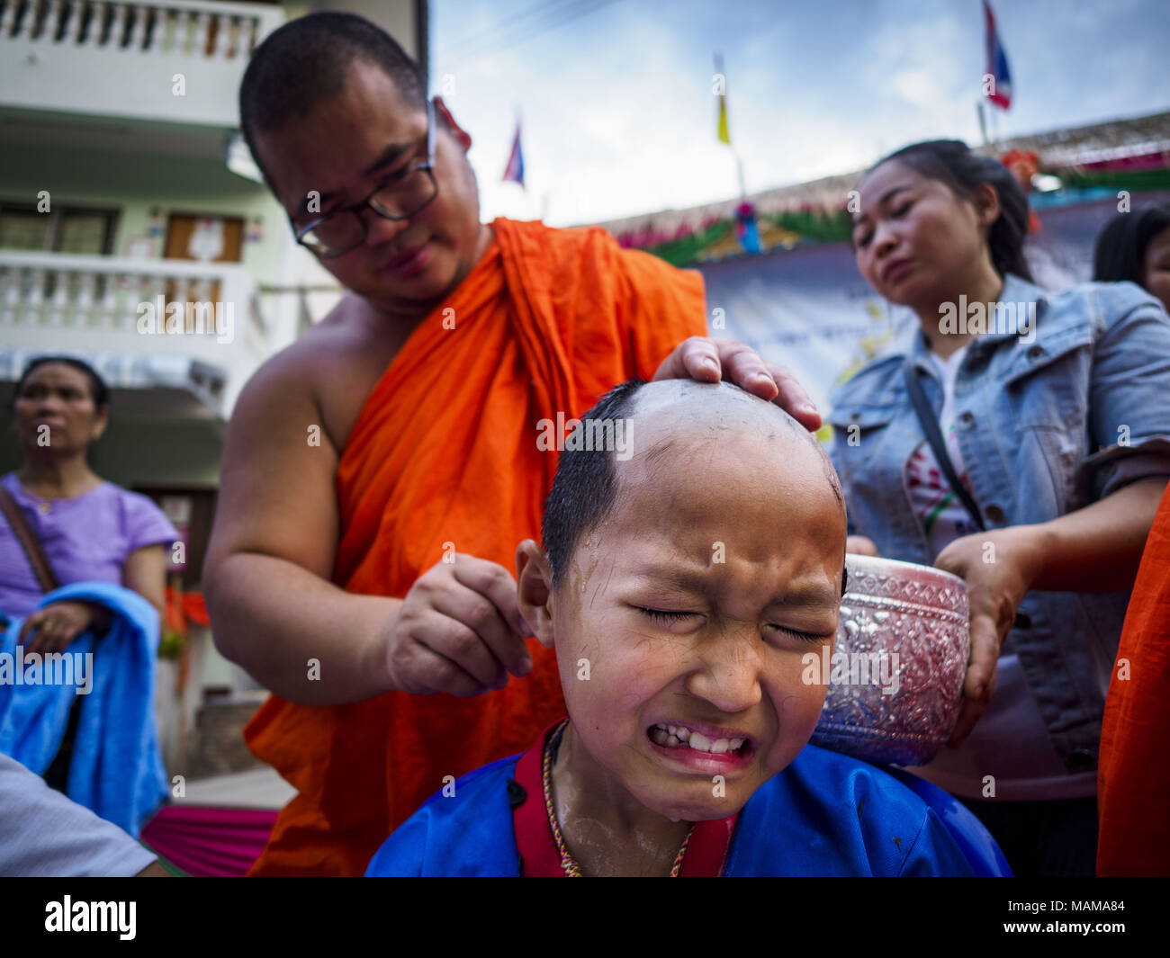 April 3, 2018 - Chiang Mai, Thailand - A Shan boy reacts as a Buddhist ...