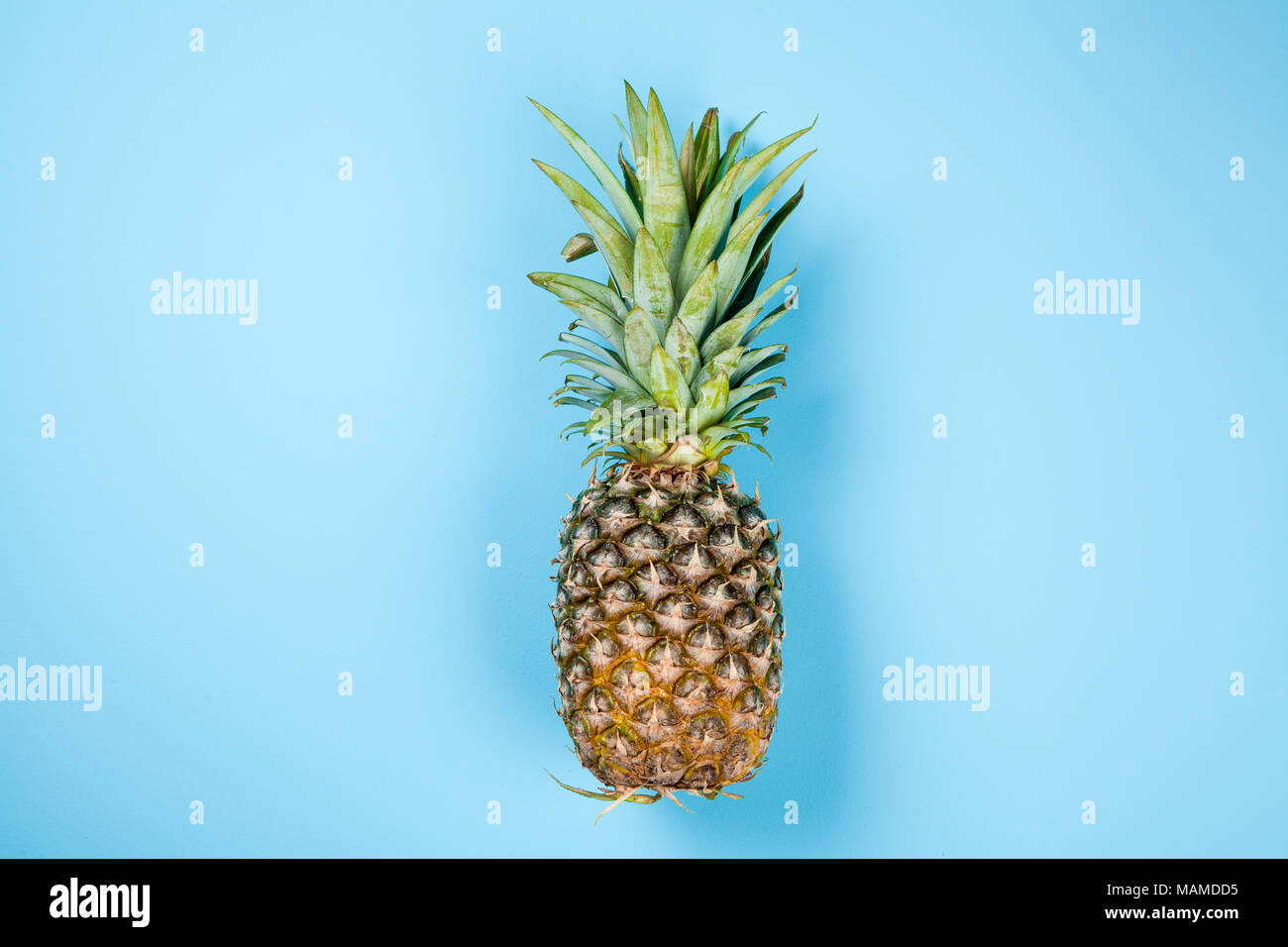 Pineapple on color background Stock Photo - Alamy