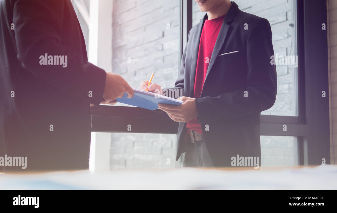 Businessmen meeting to discuss and consult on the future plans of their ...