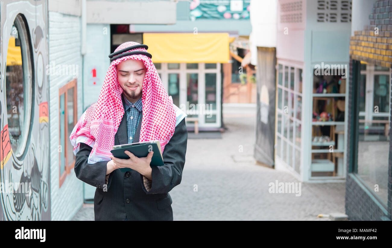 Arab business man standing and working at his market, business concept ...