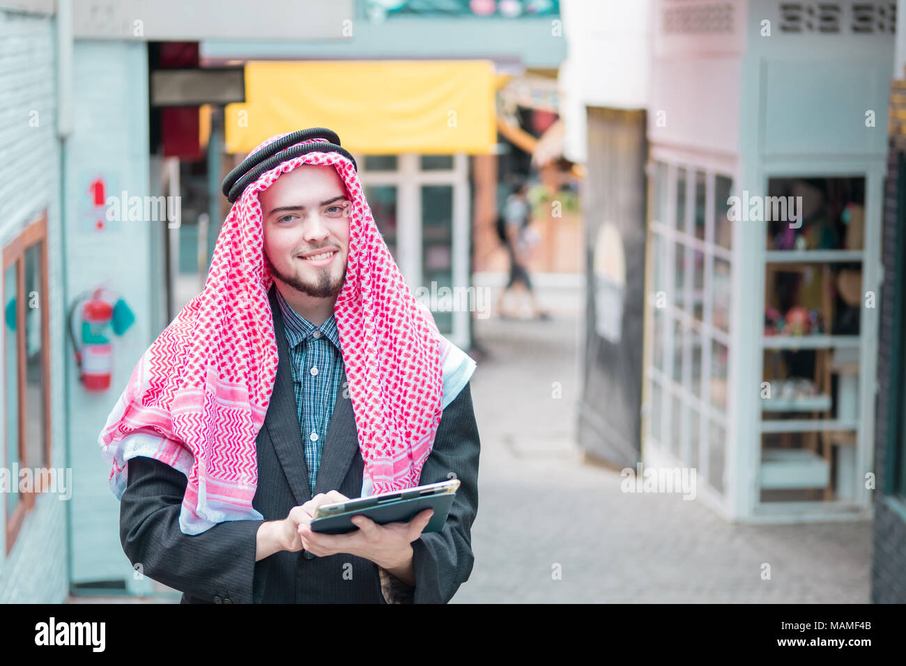 Arab business man standing and working at his market, business concept ...